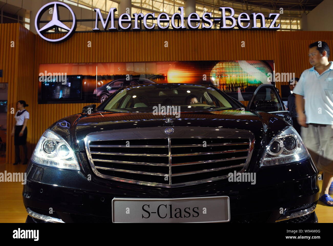 --File-- A Chinese visitor looks at a Mercedes-Benz S-Class during an ...