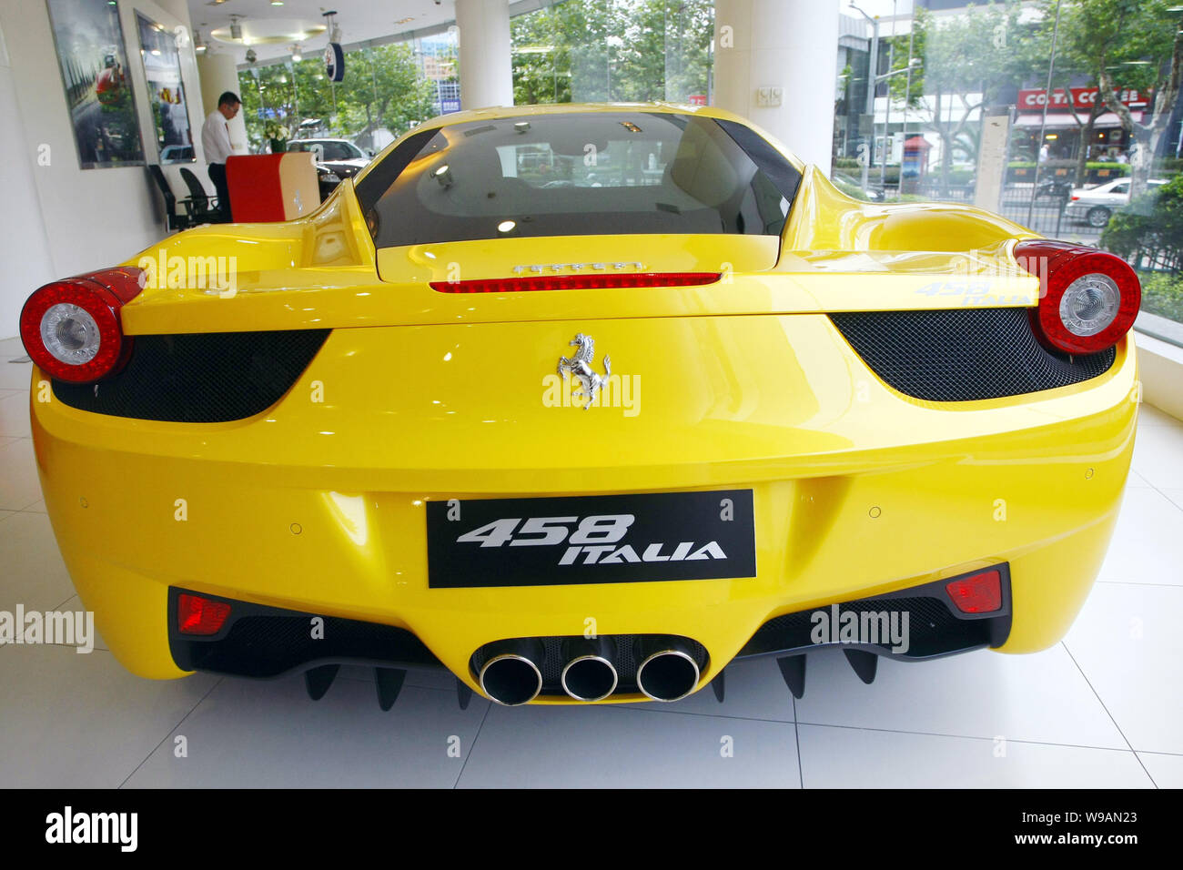 A Ferrari 458 Italia sports car is displayed in a Ferrari store in ...