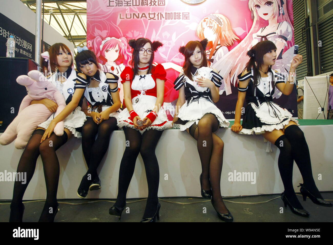 Chinese entertainers wearing COSPLAY outfits rest during the 8th China ...