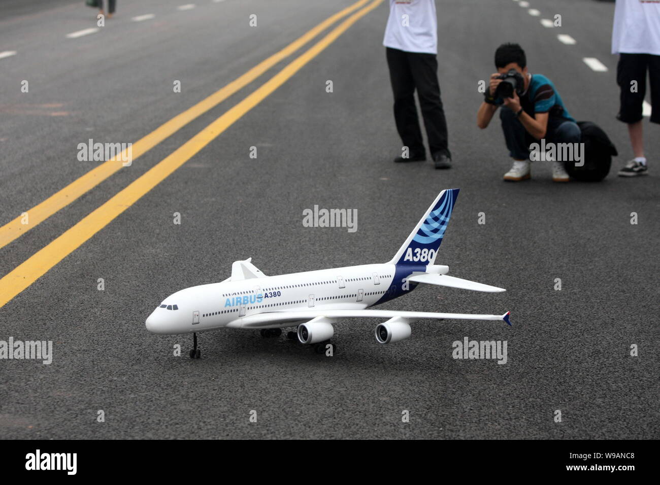 Chinese aeromodellers look at a model of Airbus A380 during an ...