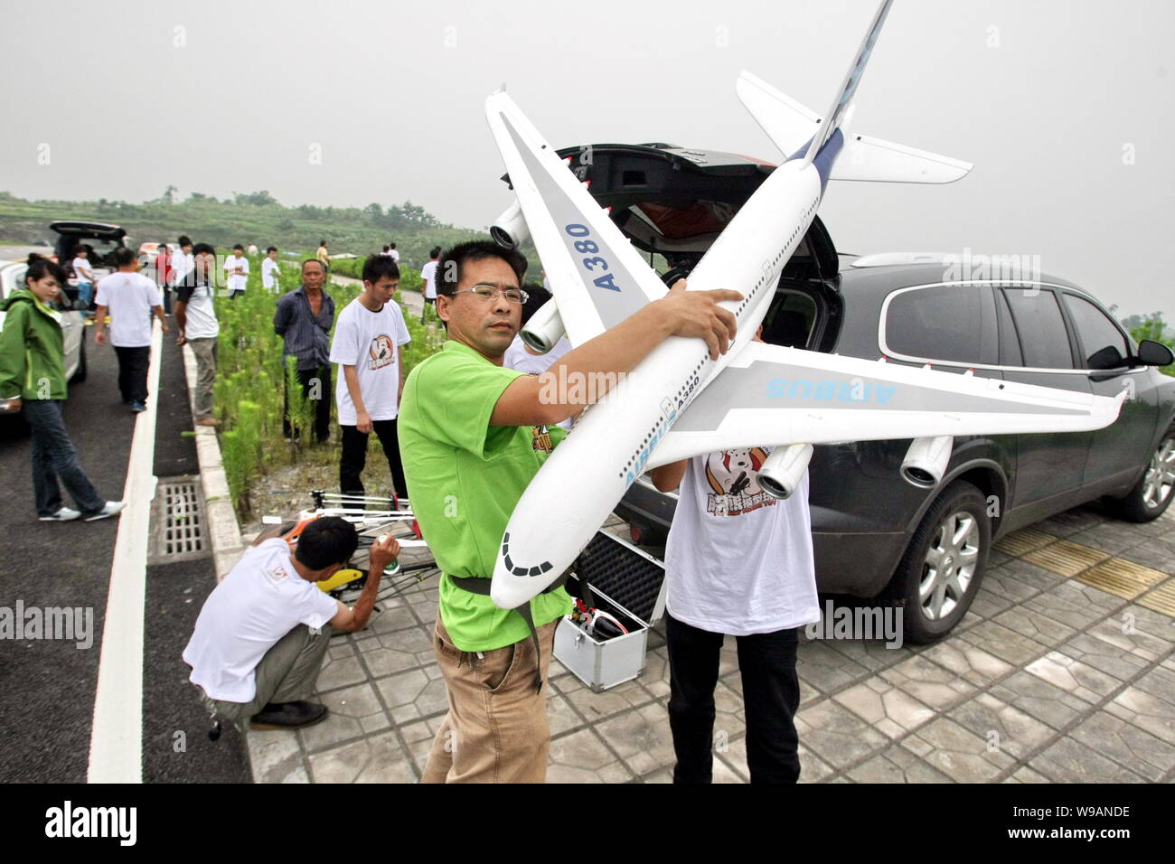 A Chinese aeromodeller tests his model of Airbus A380 during an ...