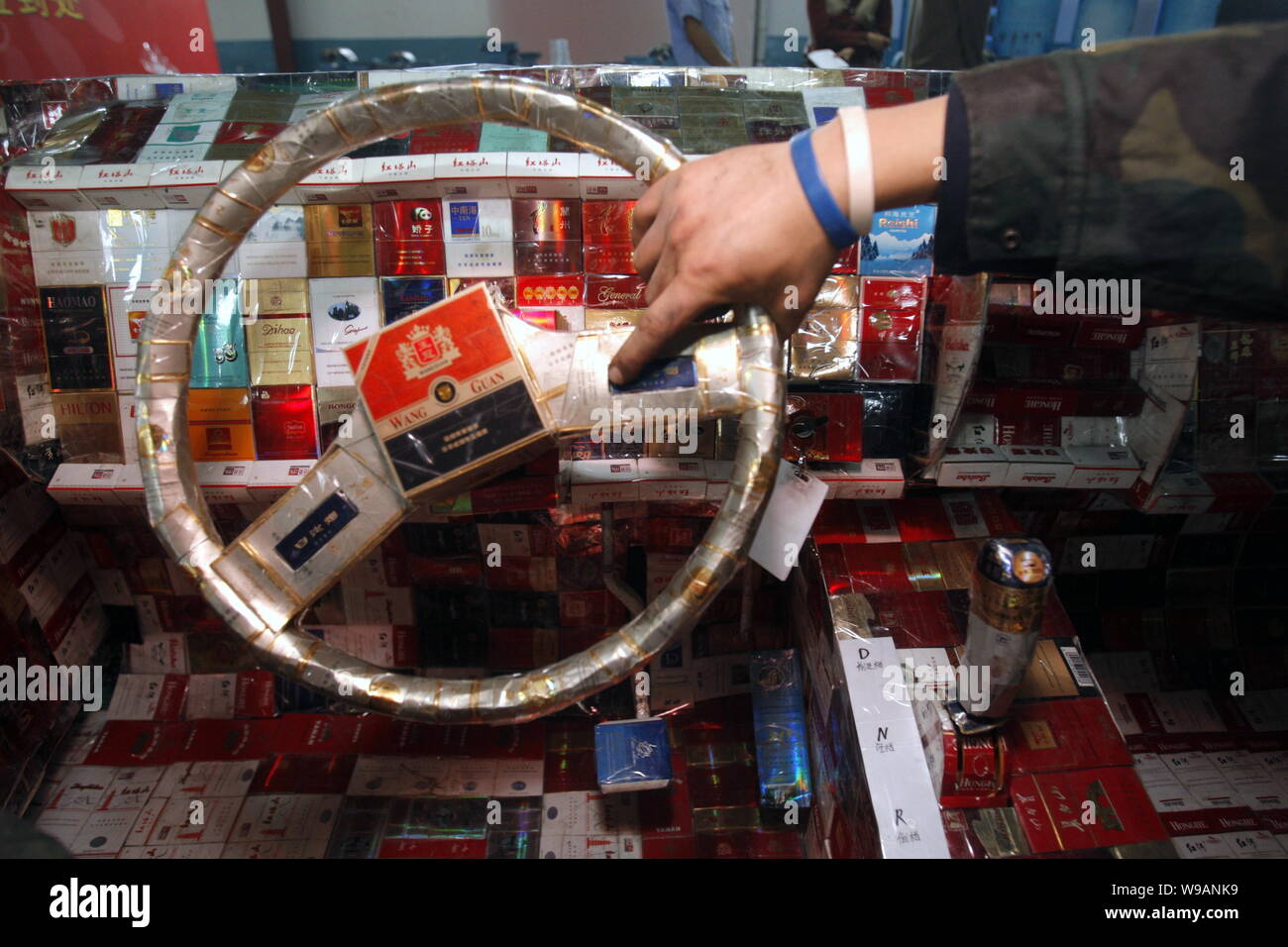 A student shows the steering wheel inside a Bugatti Veyron made of ...