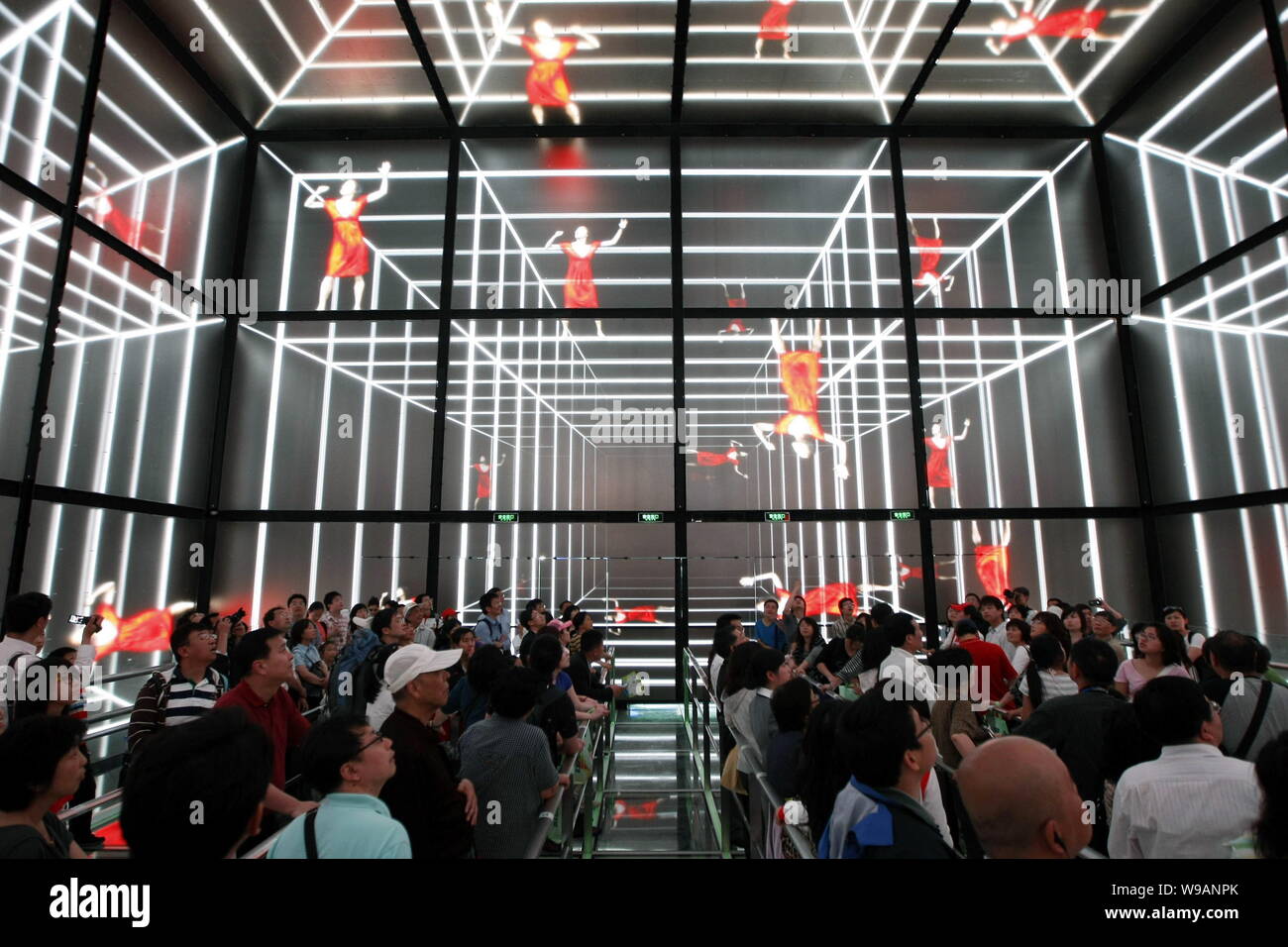 Visitors visit the State Grid Pavilion in the Expo site in Shanghai ...