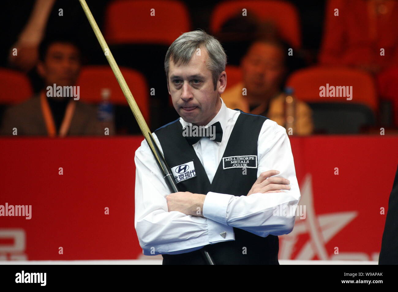 Nigel Bond of England considers while competing against Marco Fu of ...