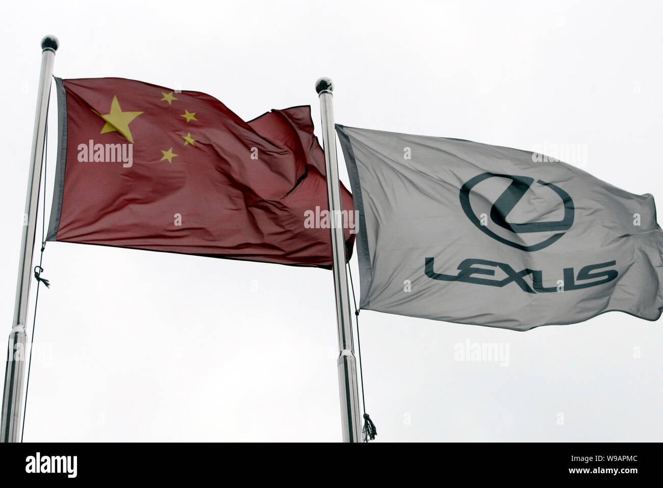 --FILE--Chinese and Lexus flags flutter outside a Lexus dealership in ...