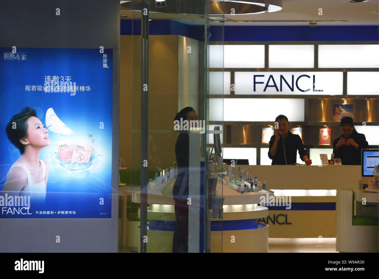 Chinese staff are seen at a Fancl store in Shanghai, China, October 13 ...