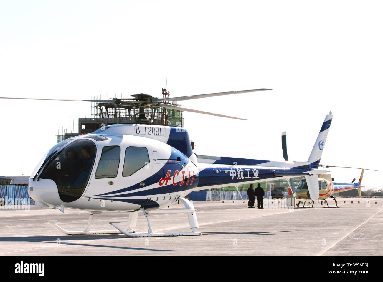 An AC311 helicopter lands on the ground after it completed its maiden ...
