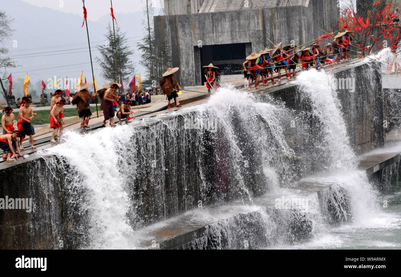 Chinese performers in traditional costumes perform during the water ...