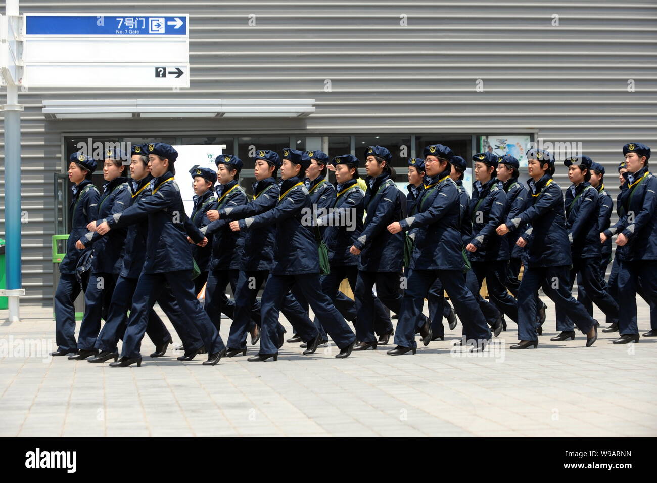 Female Chinese security guards patrol in the Expo site on the first day ...