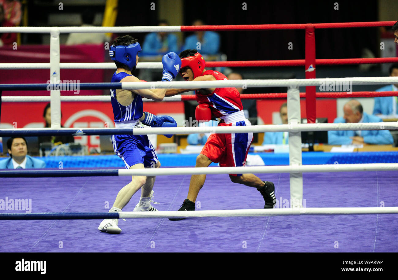 Rey Saludar of the Philippines, right, competes with Chinas Chang Yong ...