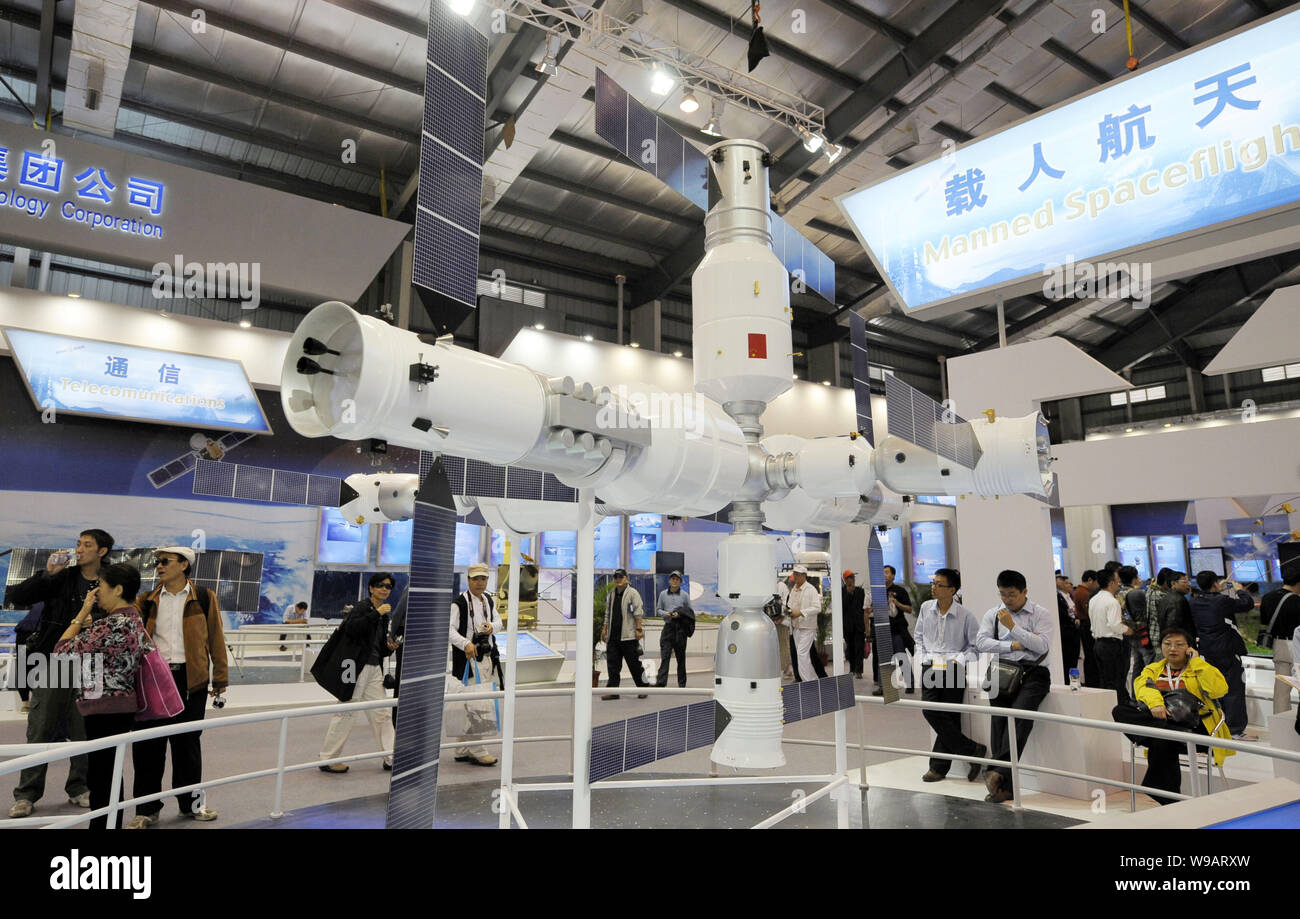 Visitors look at the model of Chinas homemade Tiangong 1 space station ...