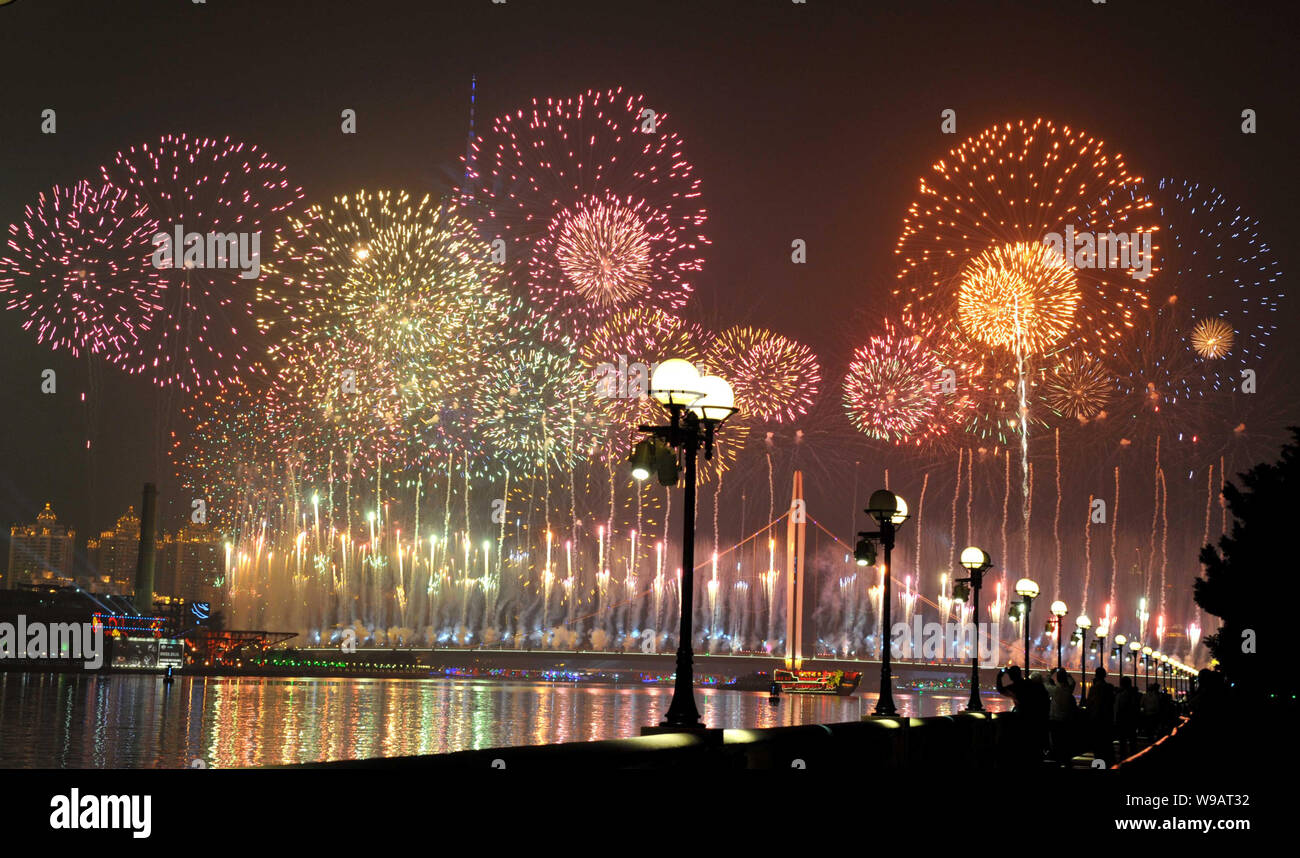 Fireworks explode over the Pearl River to celebrate the opening of the ...