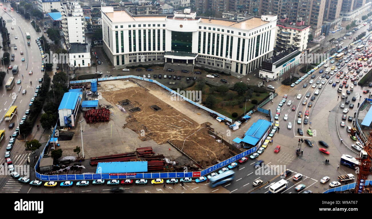 Aerial view of a long queue of taxis waiting to be refueled with ...