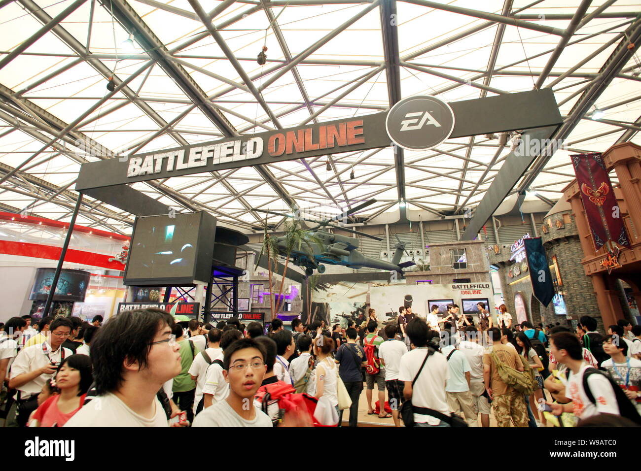 Visitors crowd the stand of Battlefield Online of EA (Electronic Arts ...