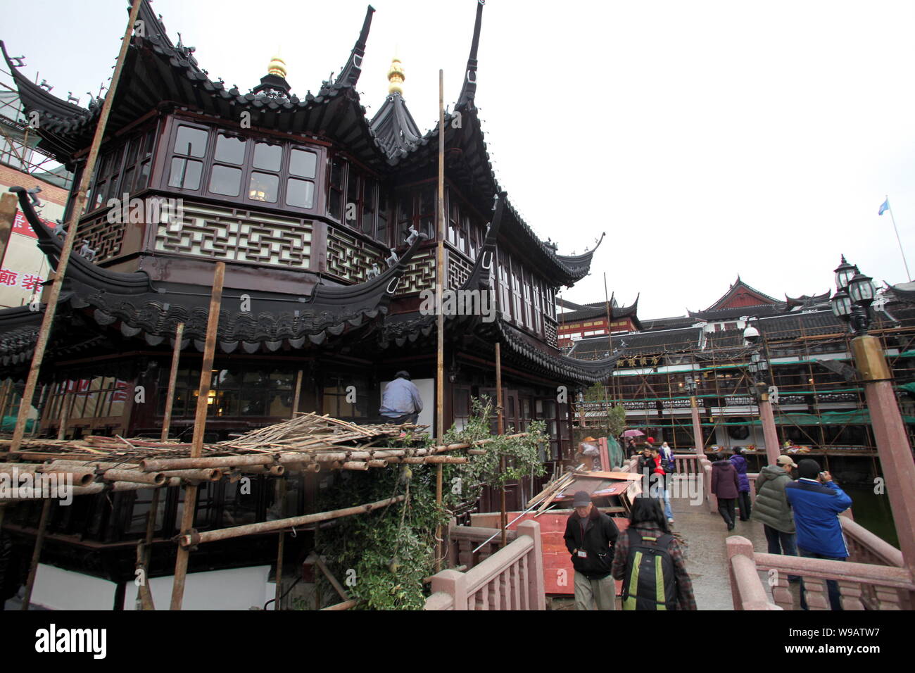 Chinese tourists walk on the Bridge of Nine Turnings (Jiuqu Bridge) in ...