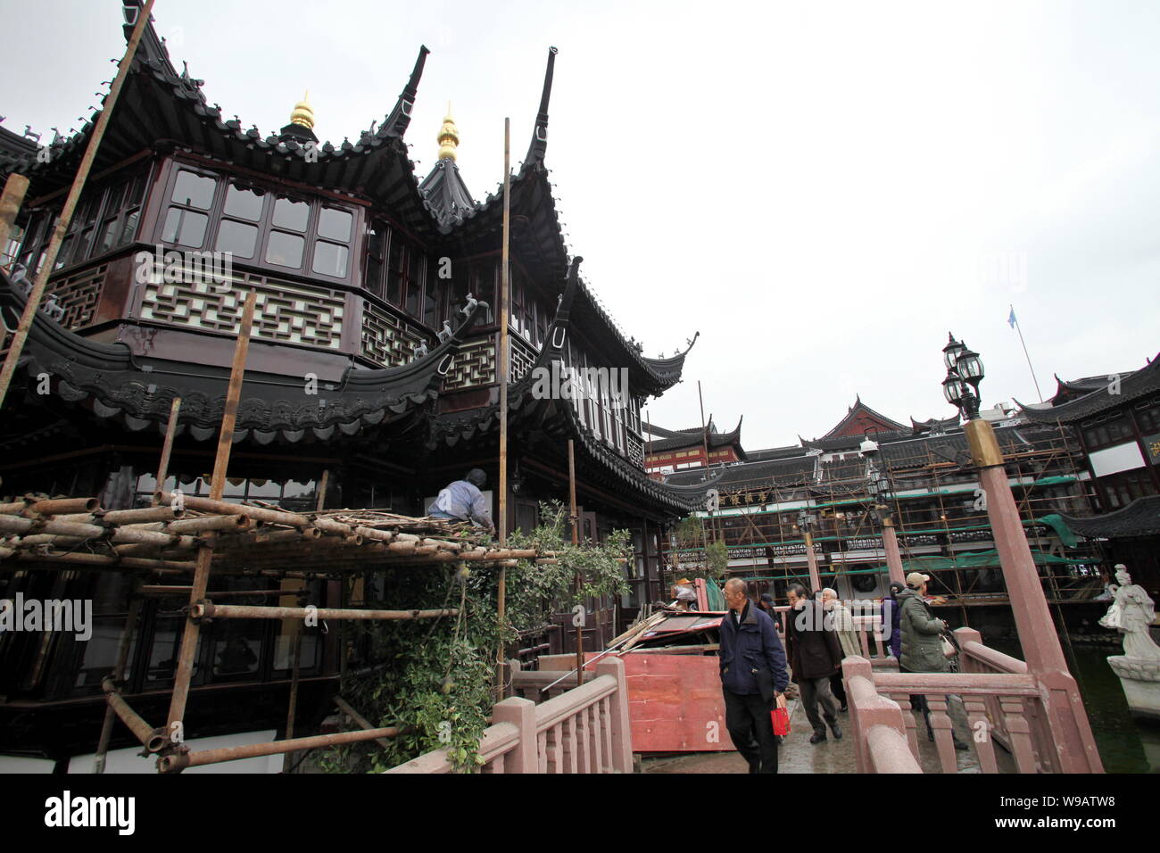 Chinese tourists walk on the Bridge of Nine Turnings (Jiuqu Bridge) in ...