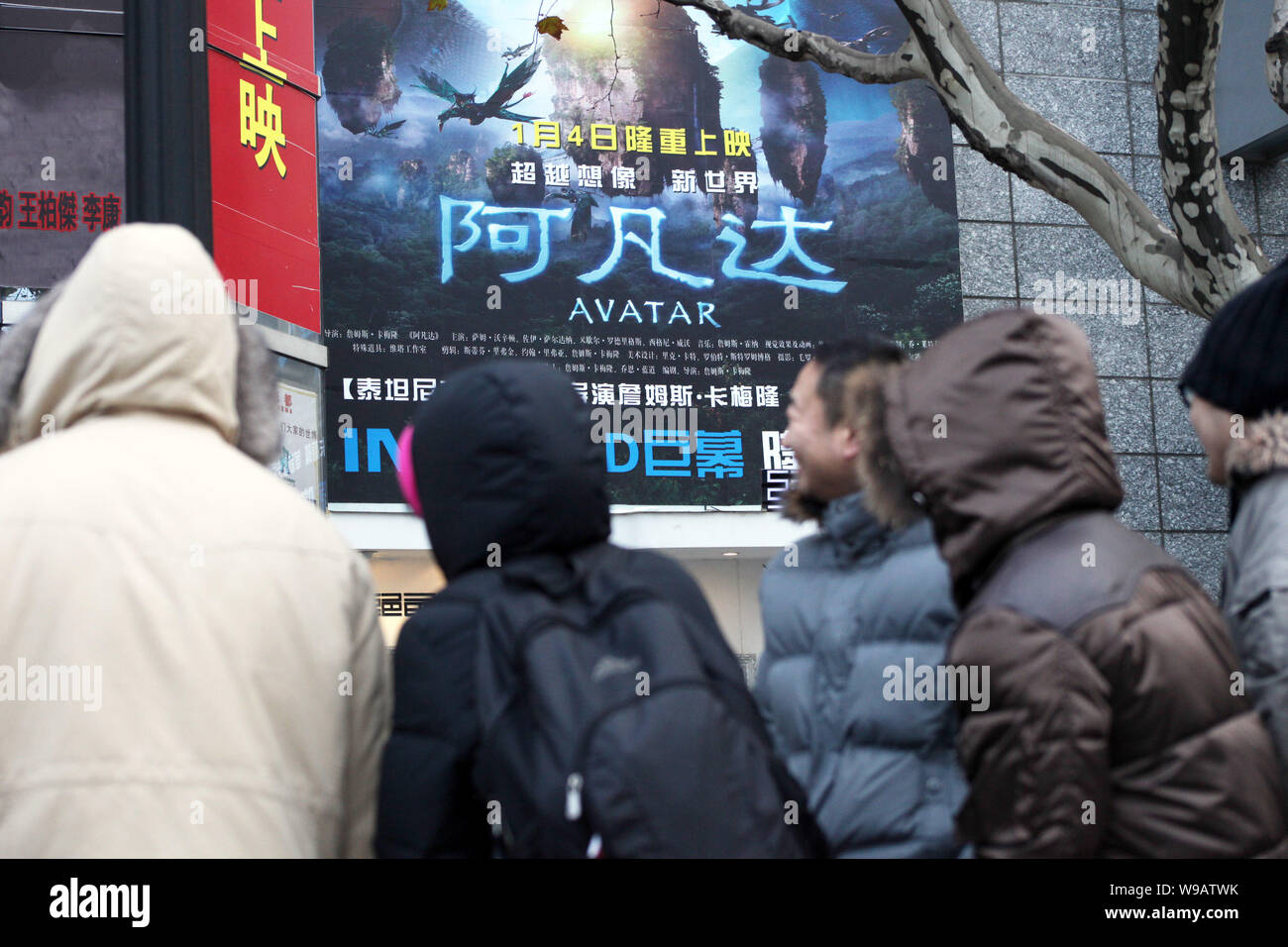 Local residents queue up to buy tickets for the movie, Avatar, outside ...
