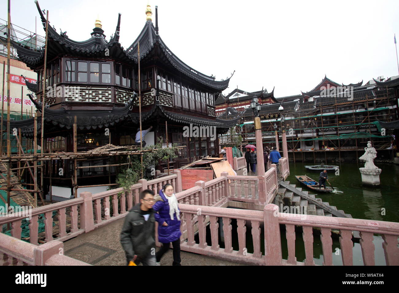 Chinese tourists walk on the Bridge of Nine Turnings (Jiuqu Bridge) in ...