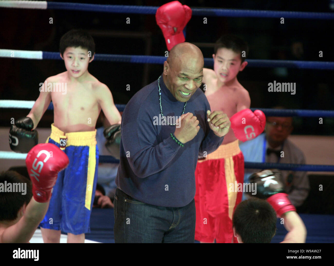U.S. boxer Mike Tyson interacts with young boxers during the First ...