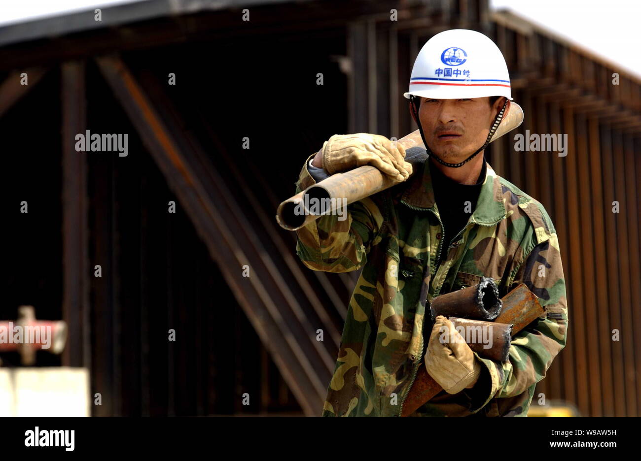--FILE--A Chinese worker of China Railway Group Limited (CREC) delivers ...