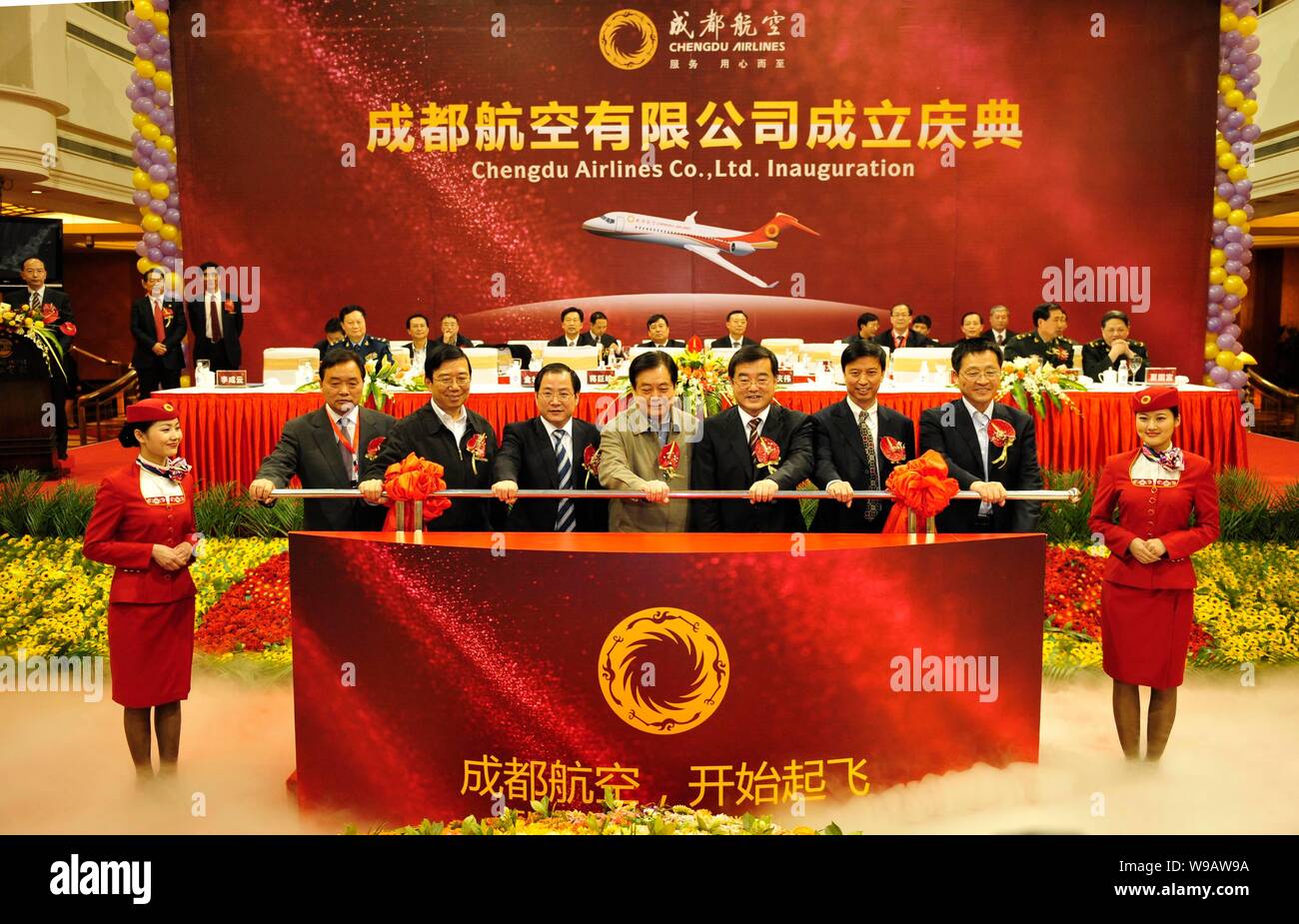 Officials pose during the founding ceremony of the Chengdu Airlines in ...