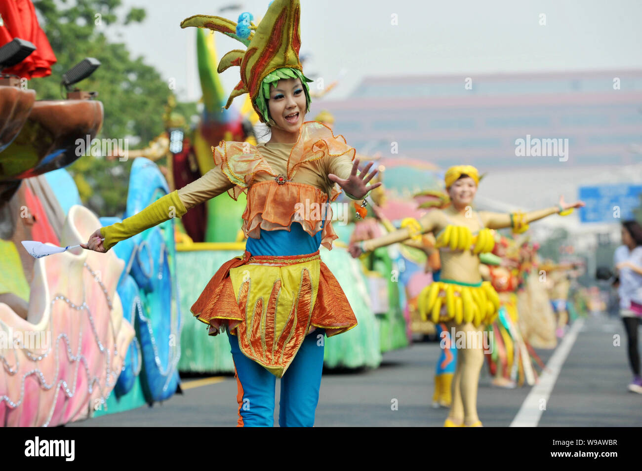 Entertainers perform during a parade in the World Expo Park in Shanghai ...