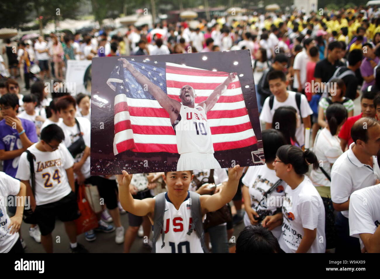 A Chinese basketball fan shows a board with the photo of NBA basketball ...