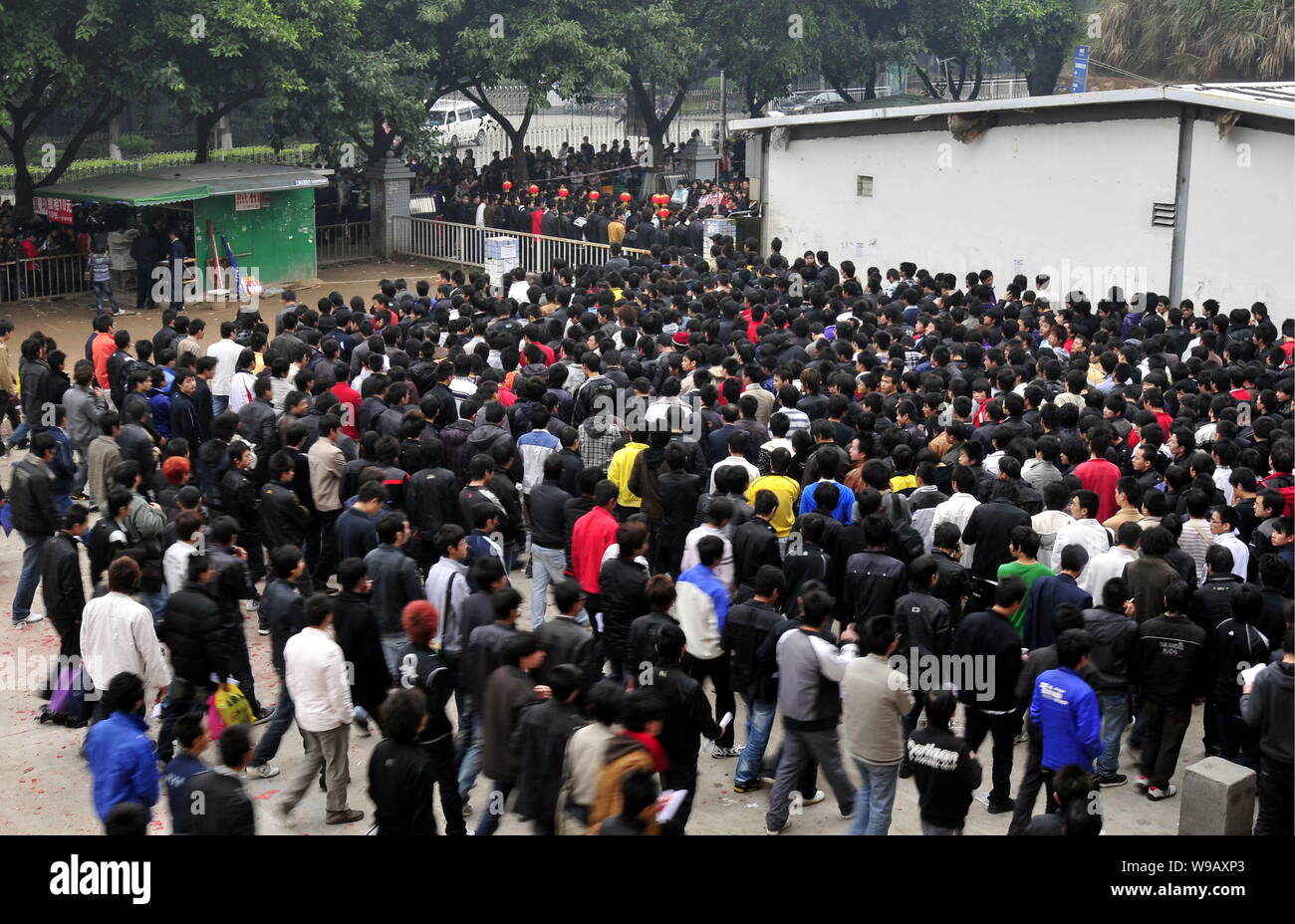 Crowds of job seekers queue up to apply for jobs during a recruitment ...