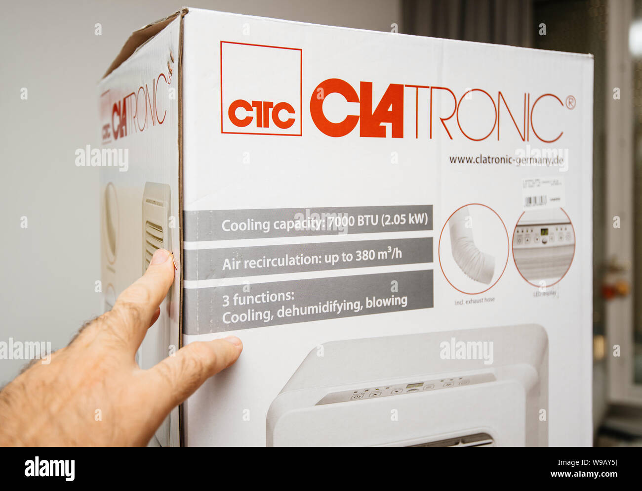 Paris, France - Jun 23, 2019: Male hand reading functions on package ...