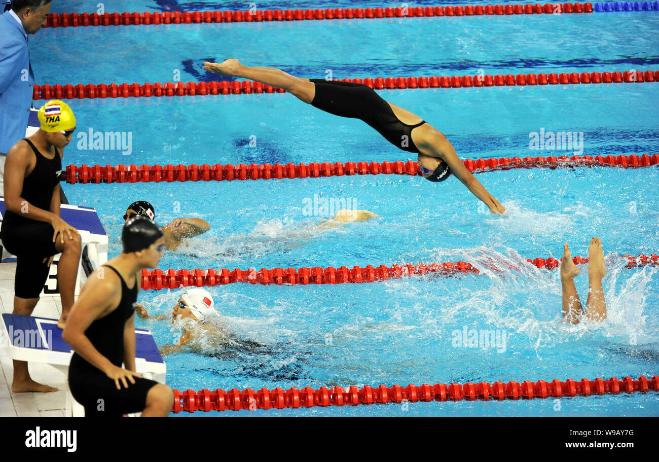 Swimmers compete in the womens 4x100m freestyle relay final at the 16th ...