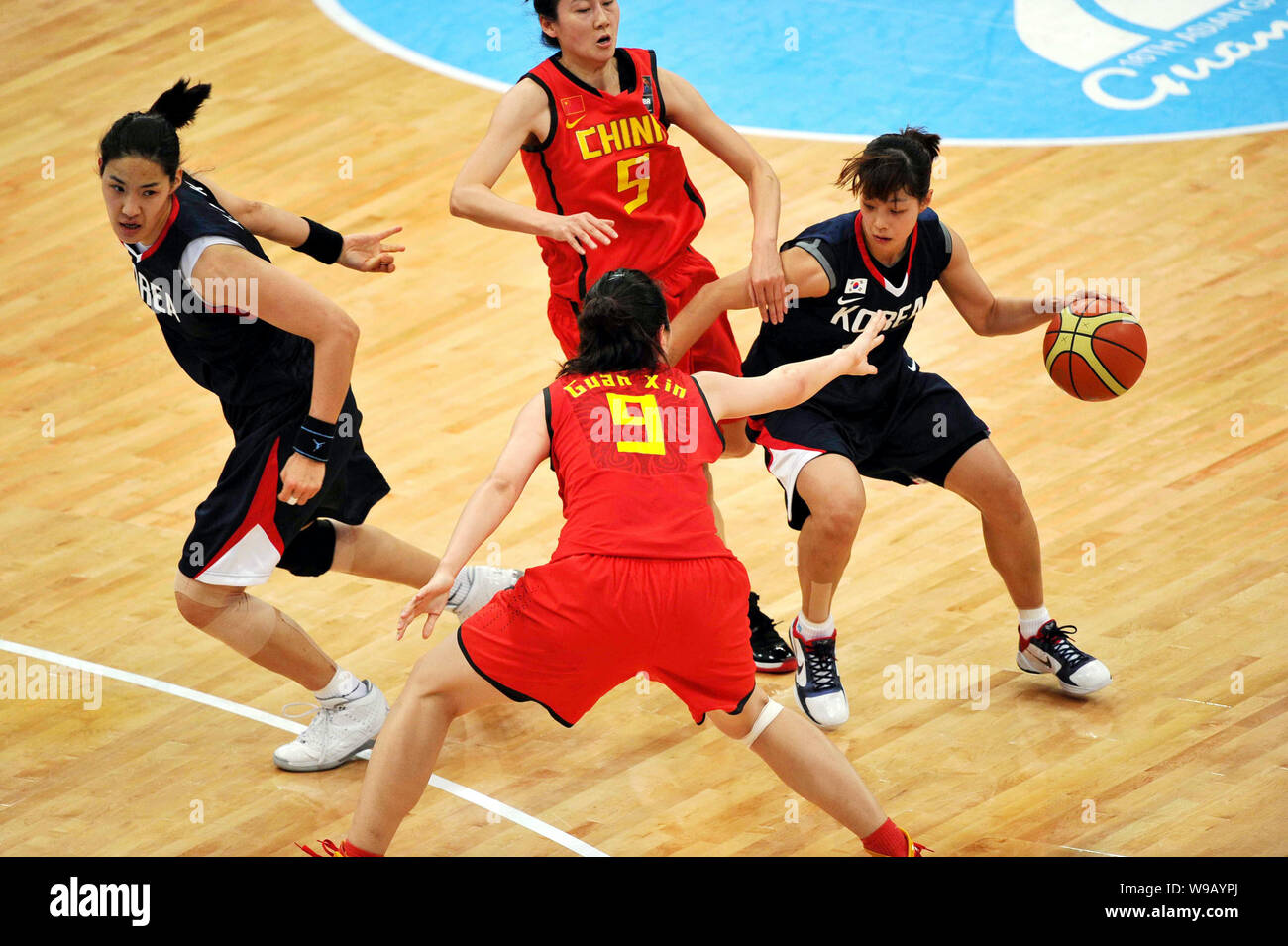 Chinas Guan Xin, center front, and Bian Lan, center back, defend against Lee Kyungeun, right, of ...