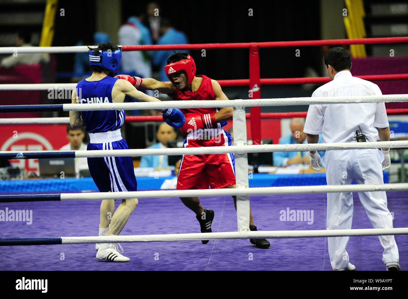 Rey Saludar of the Philippines, right, competes with Chinas Chang Yong ...