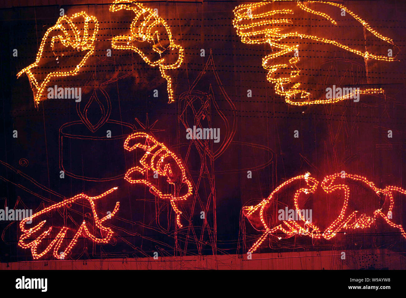 Neon-light hand signs are displayed at the opening ceremony of the ...