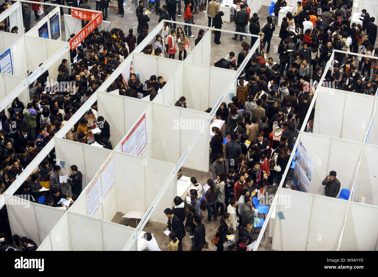 Chinese graduates crowd booths during a job fair in Wuhan city, central ...