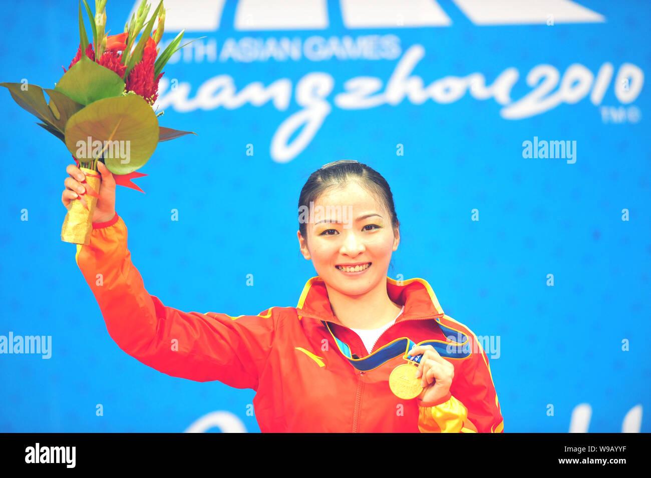 Chinas Lin Fan poses on the podium during the medal ceremony after ...