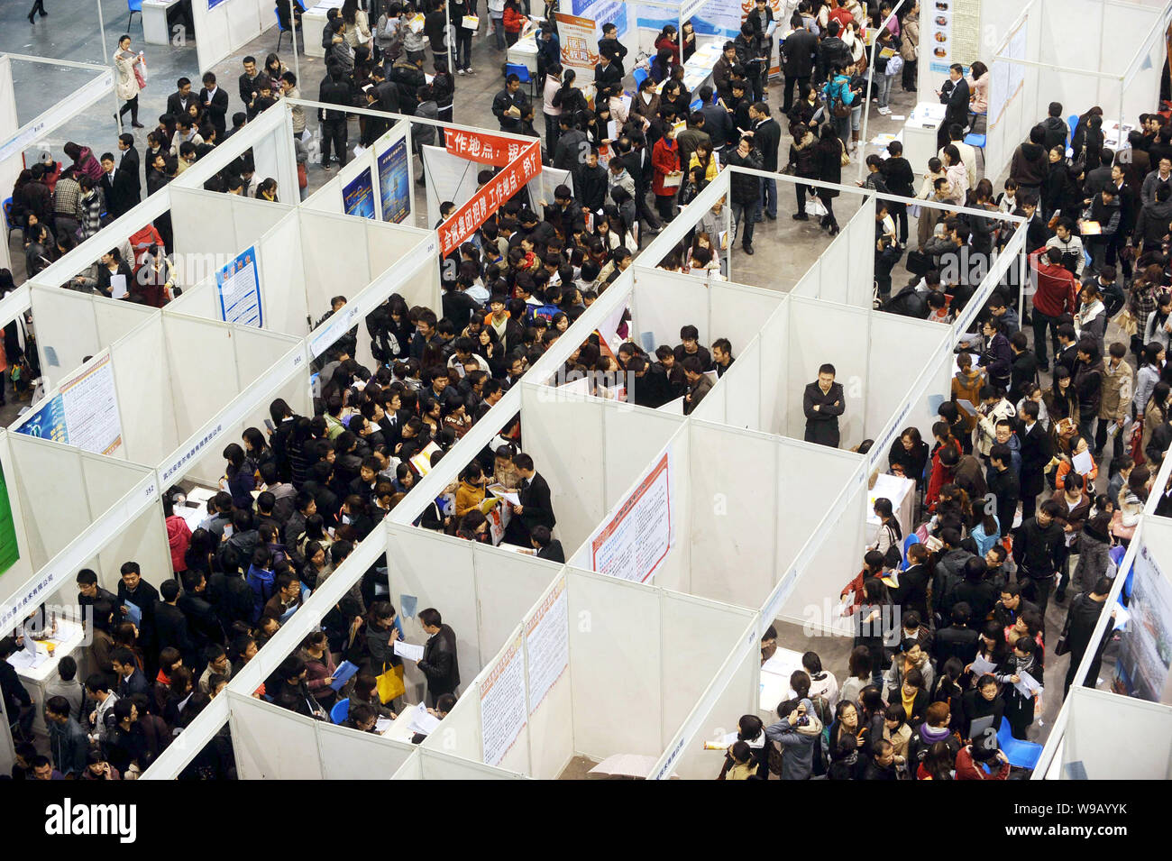 Chinese graduates crowd booths during a job fair in Wuhan city, central ...