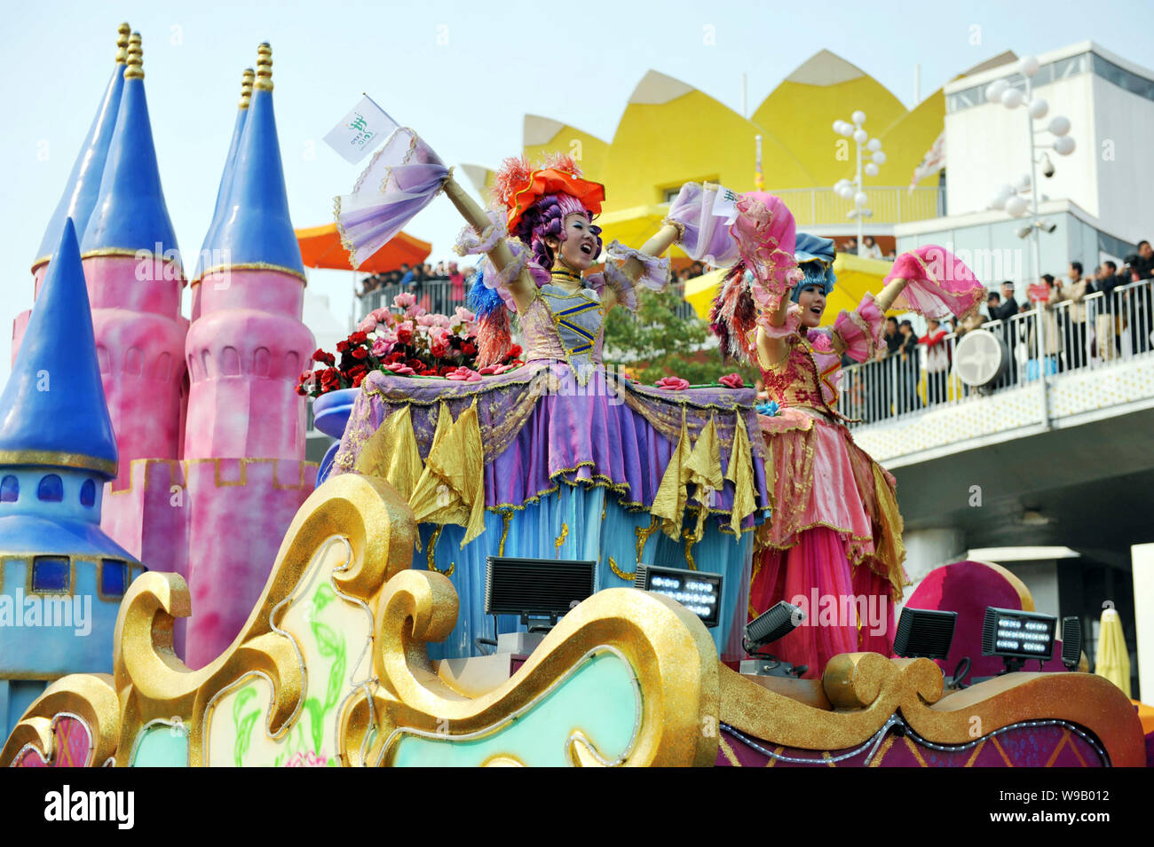 Entertainers celebrate during a parade in the World Expo Park in ...