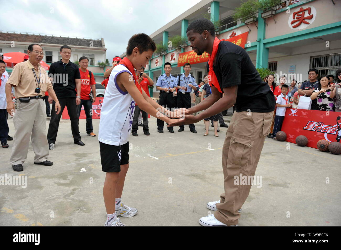 NBA basketball players Aaron Brooks of the Houston Rockets cheers up ...