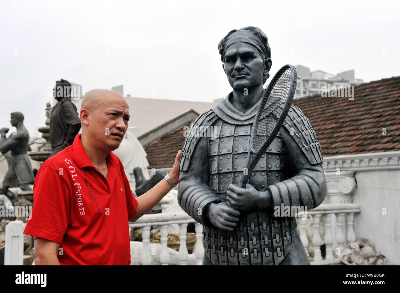 Chinese sculptor Chen Haiyan speaks to the press next to the terracotta ...
