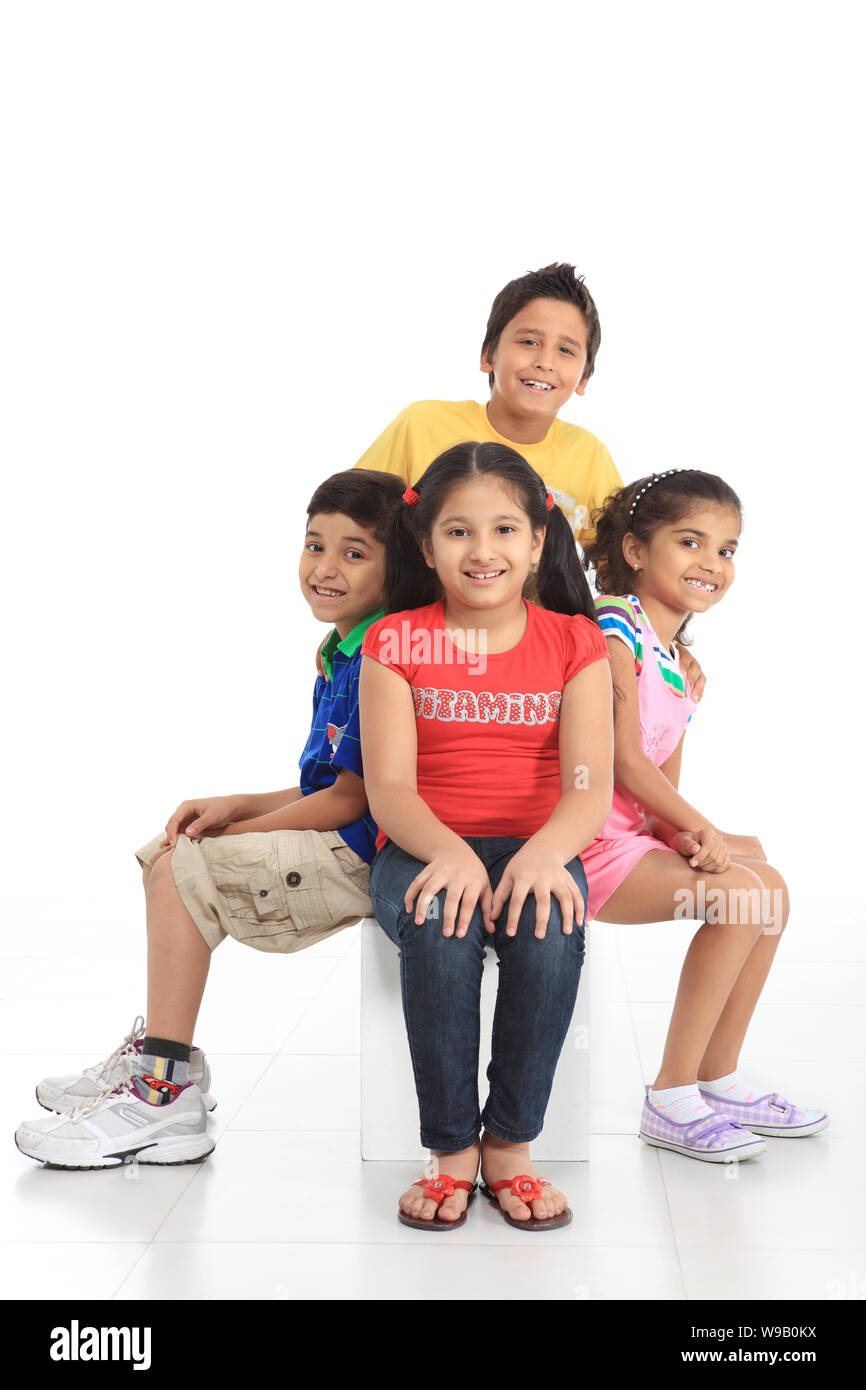 Group of children smiling Stock Photo - Alamy
