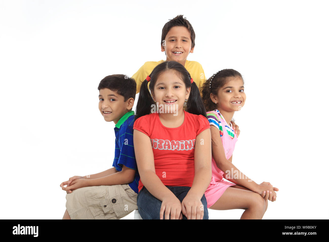 Group of children smiling Stock Photo - Alamy