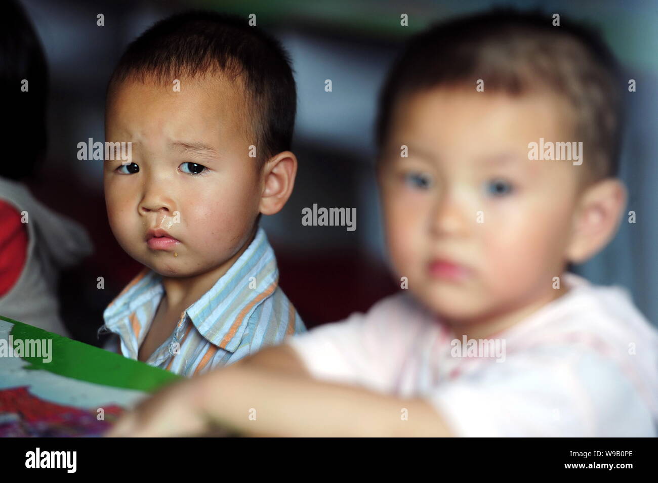 A Chinese kid cries after hearing that they can not come back again at ...
