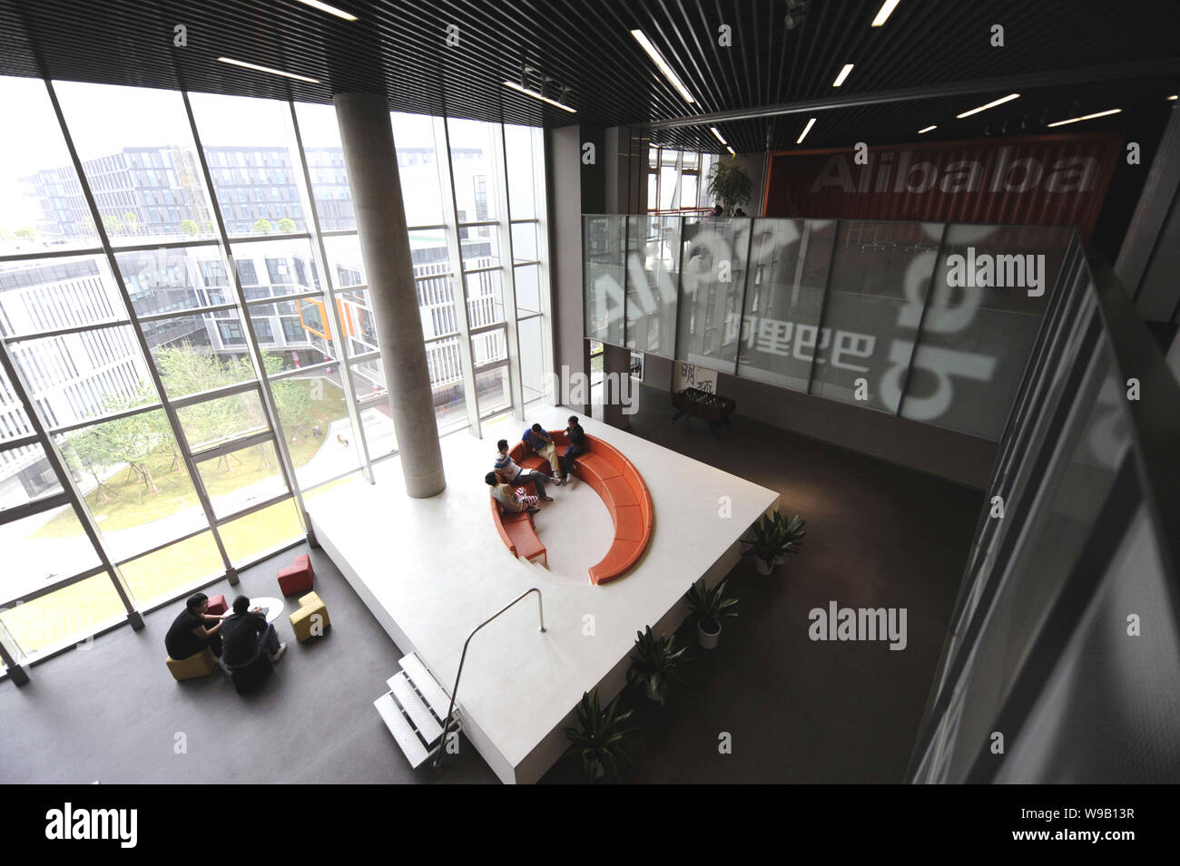 Chinese staff are seen at the head office of Alibaba Group in Hangzhou ...