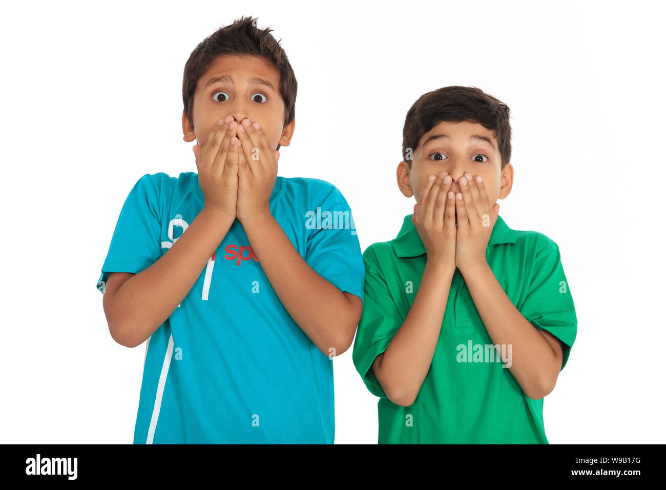 Portrait of two boys looking shocked Stock Photo - Alamy