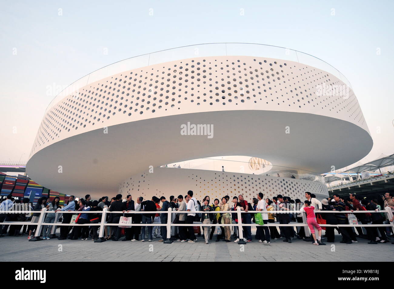 Crowds of visitors queue up to enter the Denmark Pavilion in the Expo ...