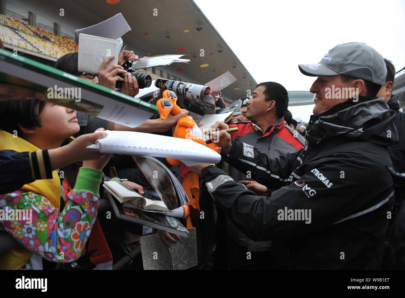 German F1 driver Michael Schumacher of Mercedes GP team signs ...