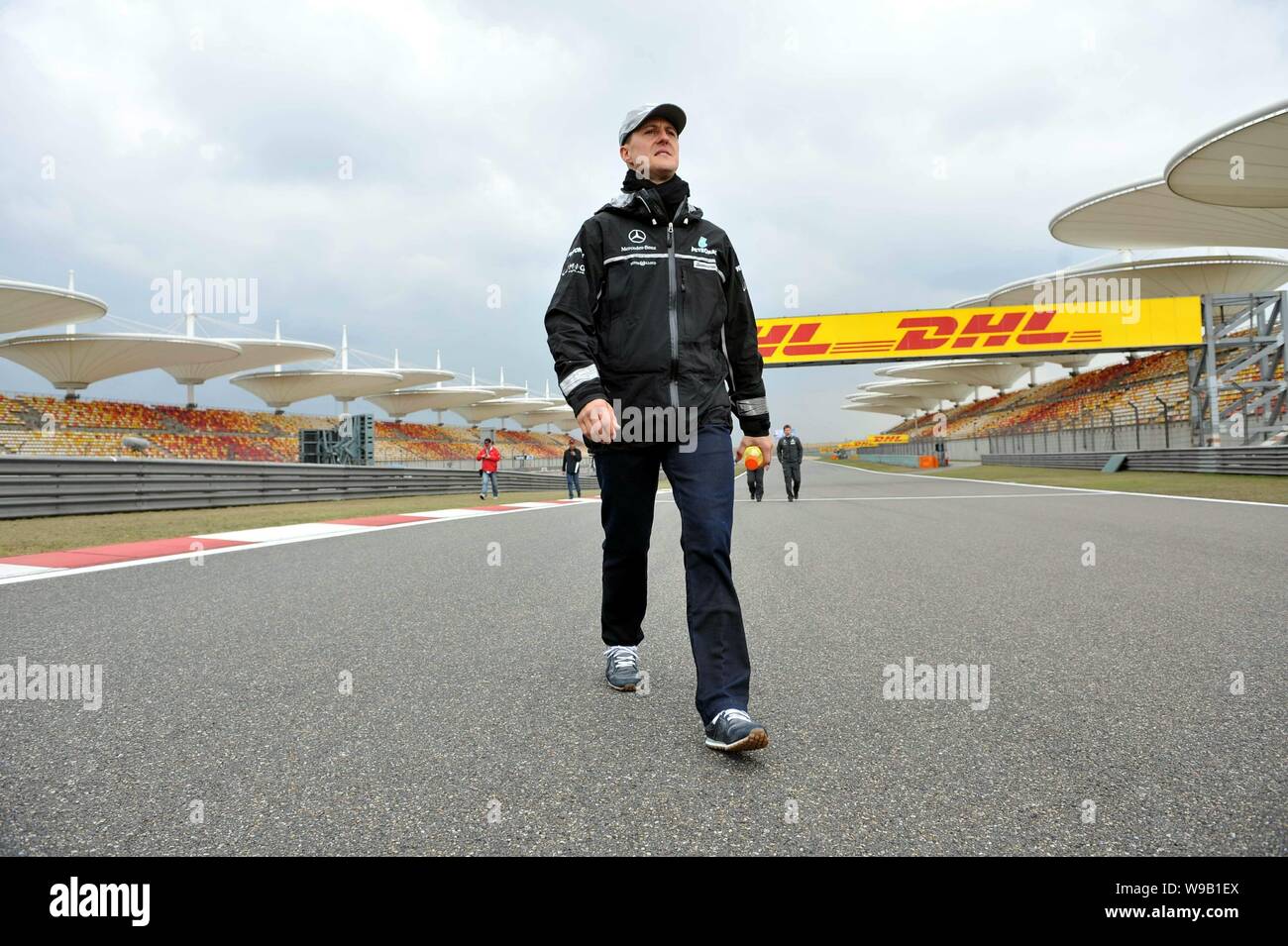German F1 driver Michael Schumacher of Mercedes GP team walks on the ...