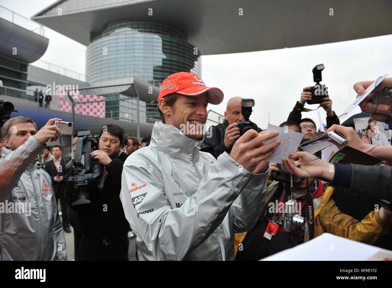 British F1 driver Jenson Button of McLaren Mercedes team signs ...