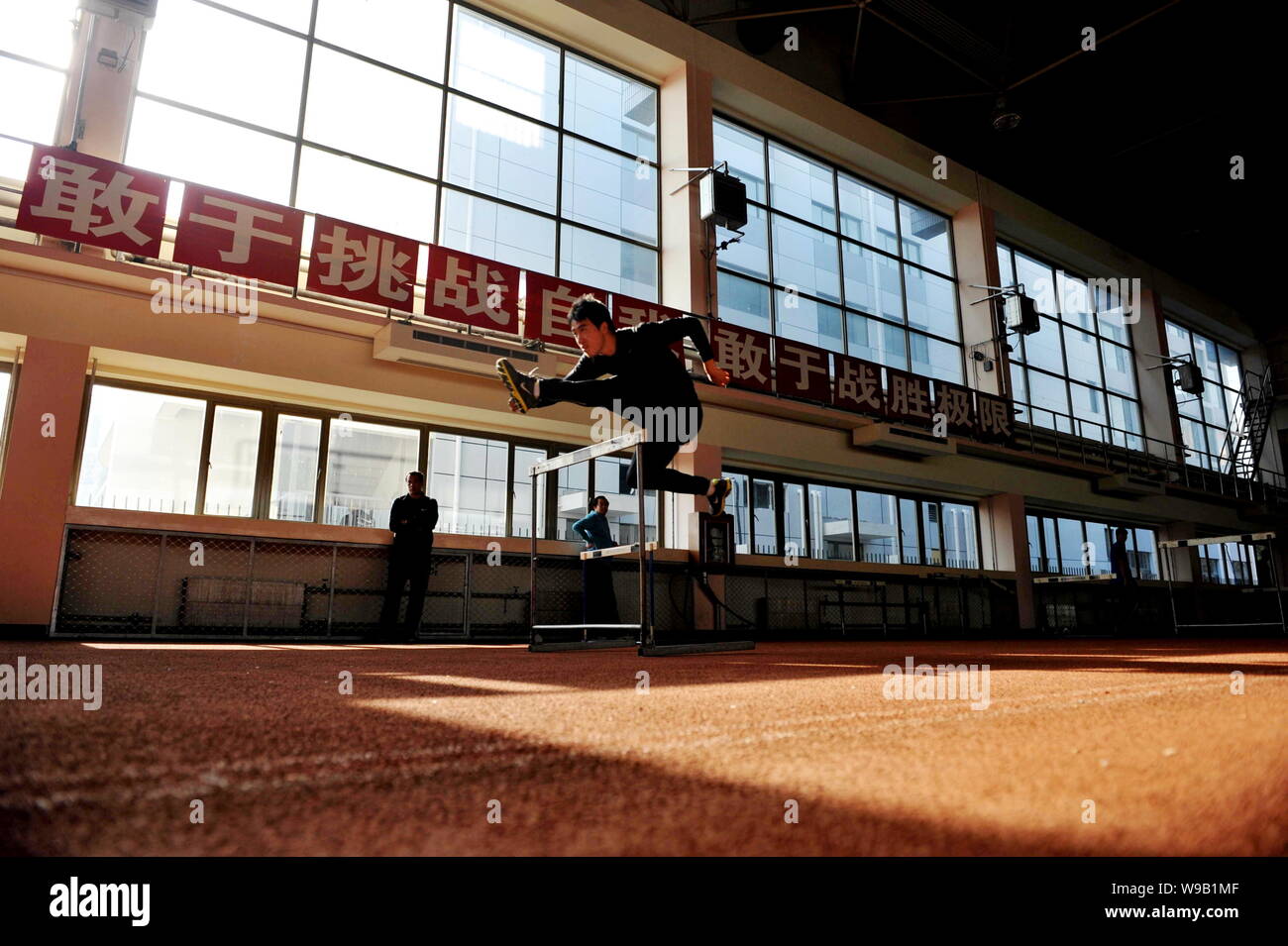 Chinese star hurdler Liu Xiang exercises during a training session at ...
