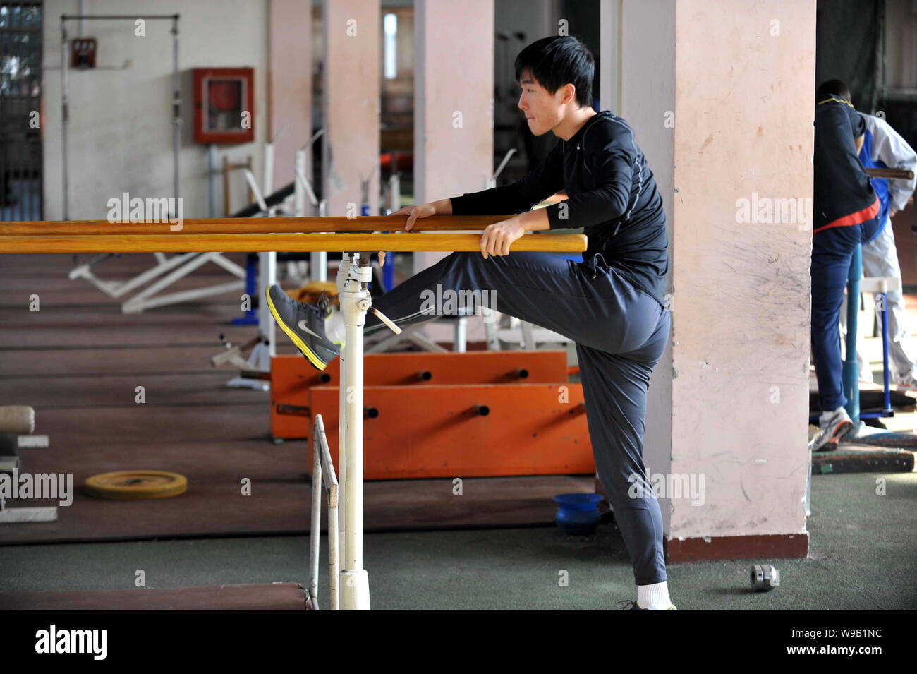 Chinese star hurdler Liu Xiang exercises during a training session at ...